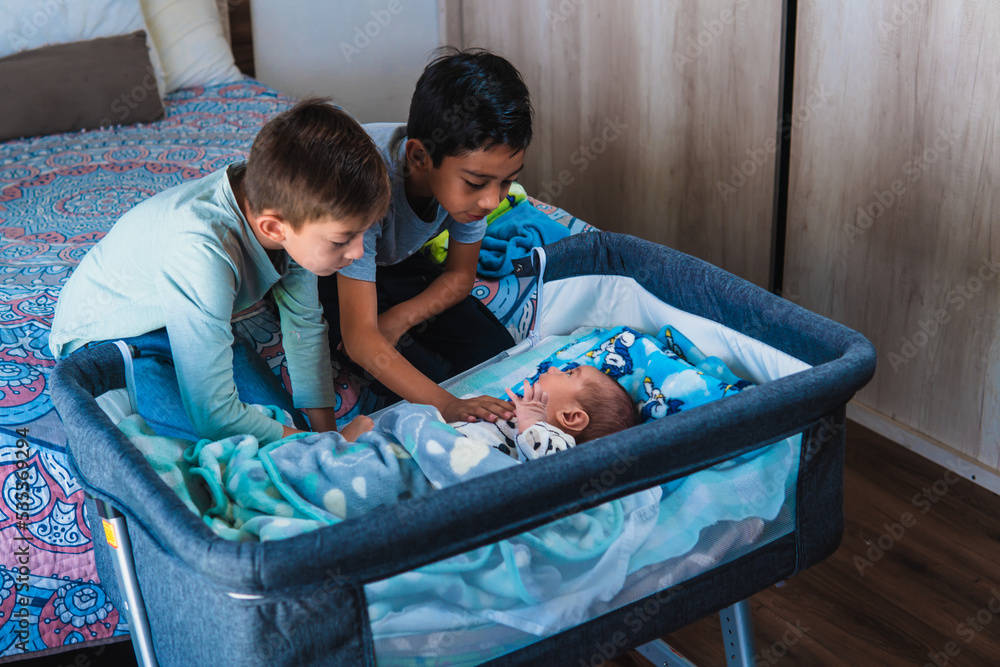 High quality photography. Two little boys with their newborn brother in ...