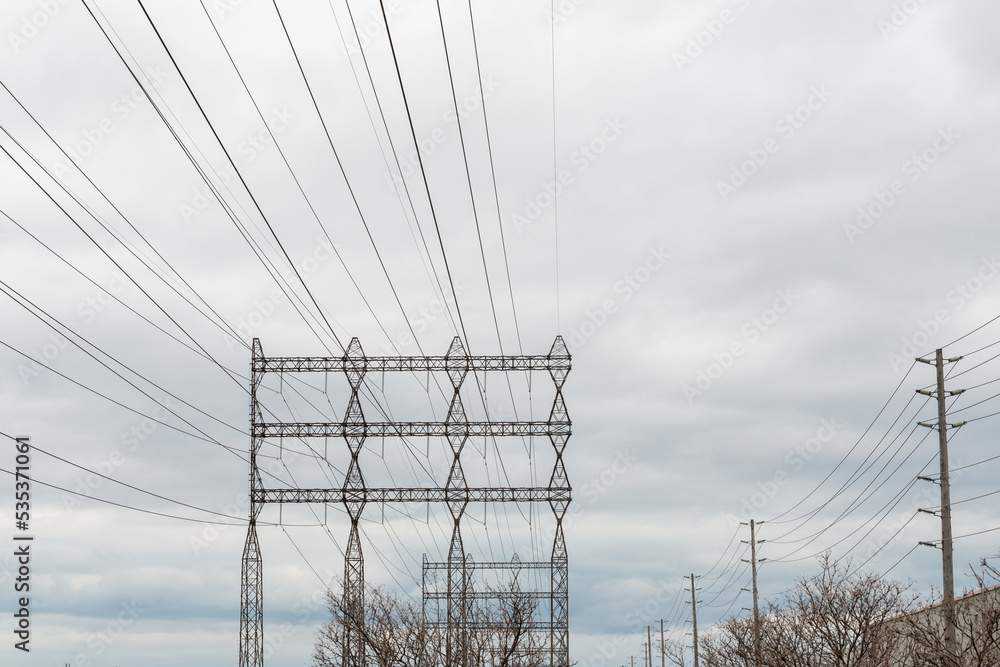An electric utility pole with electrical wires, transmission lines ...