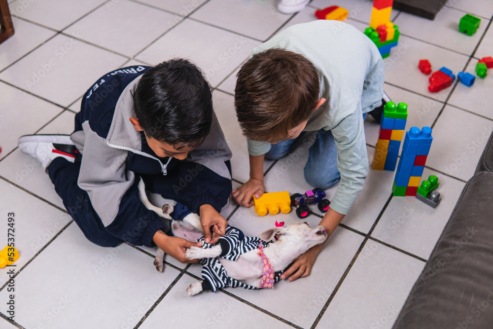 High quality photography. Top view of 2 children playing on the floor ...