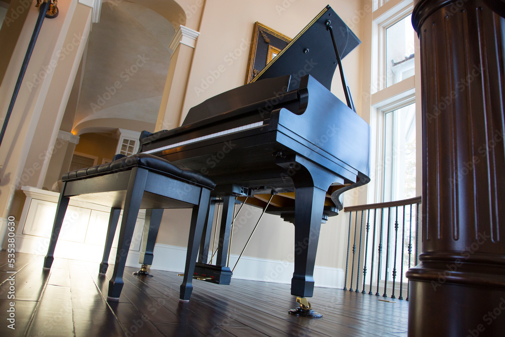 Poster Grand piano from a low angle looking like an architectural ...