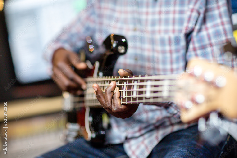 Black man playing the guitar Stock Photo | Adobe Stock