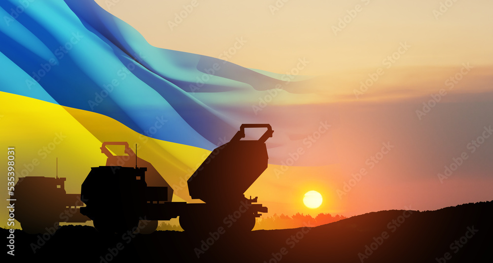 Artillery rocket system are aimed to the sky at sunset with Ukrainian ...
