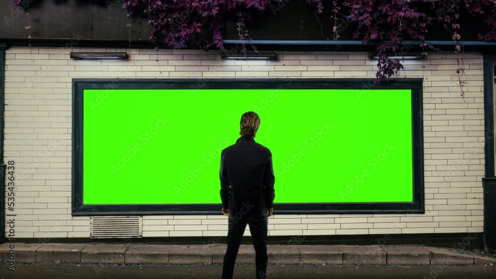 Video „Street Panel Wall Man Looking Green Screen Billboard Zoom In ...