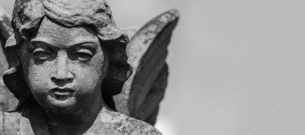 Foto de Very ancient stone statue of angel. Ancient statue. Copy space ...