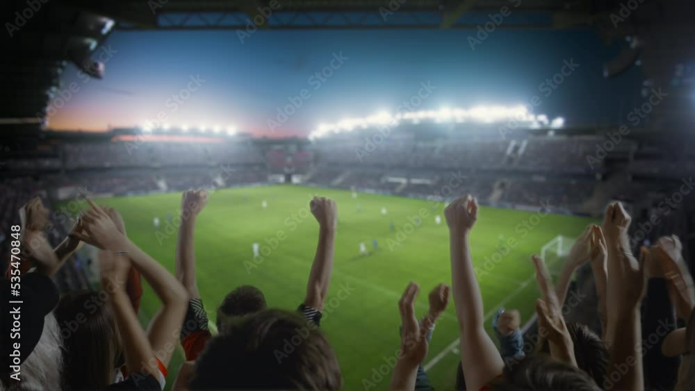 Establishing Shot of Fans Cheer for Their Team on a Stadium During ...