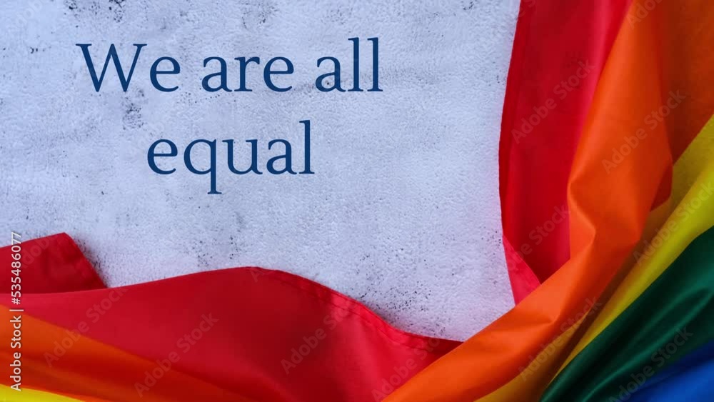 4k zoom in out Rainbow flag with text WE ARE ALL EQUAL message. Rainbow ...