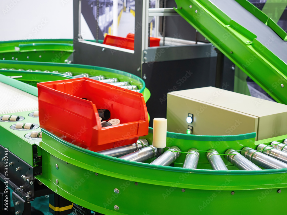 Foto Stock Transportation of goods within warehouse. Conveyor belt. Red ...