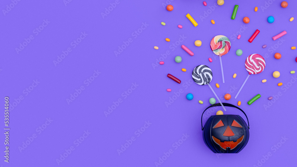 Black Halloween pumpkin bucket with scattered candies. Assorted candies ...