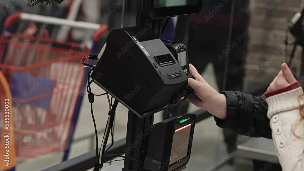 Buyer enters password PIN code at cashless payment terminal. Customer ...