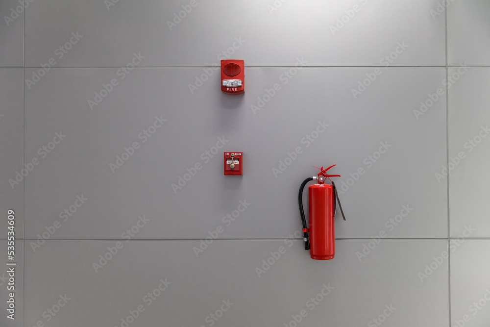 Dry chemical powder fire extinguisher in corridor. Install a fire ...