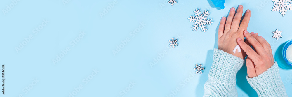 Woman using winter cream for hands. Girl hands with cream flat lay on ...