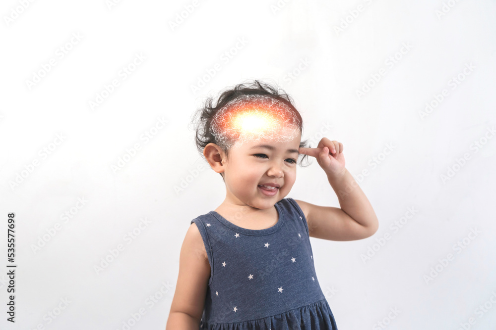 Smart Asian child girl pointing finger on her brain isolated on white ...