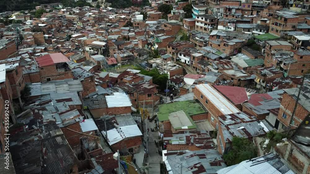 Medellin, Colombia, drone aerial view of Comuna 13 slums, favela. Once ...