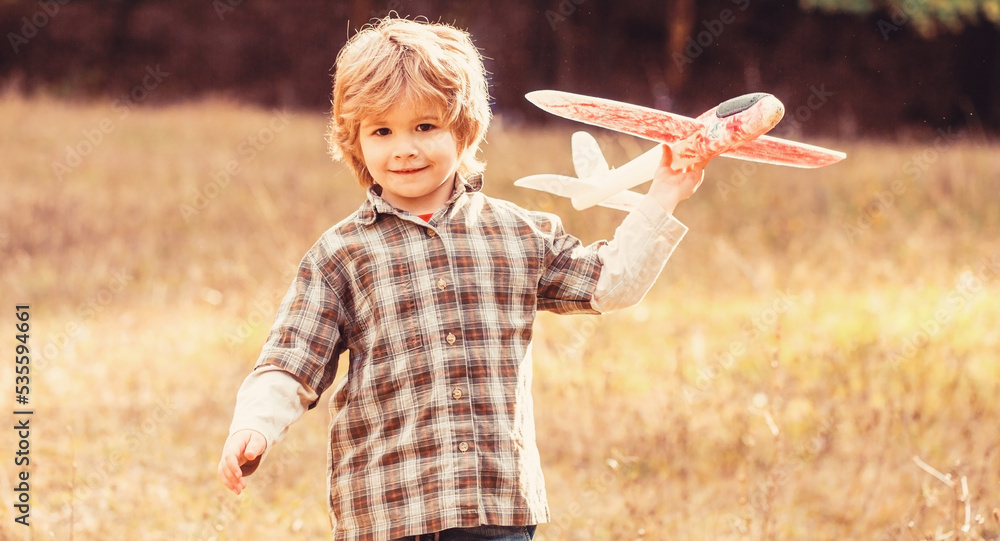 Happy boy play airplane. Little boy with plane. Little kid dreams of ...