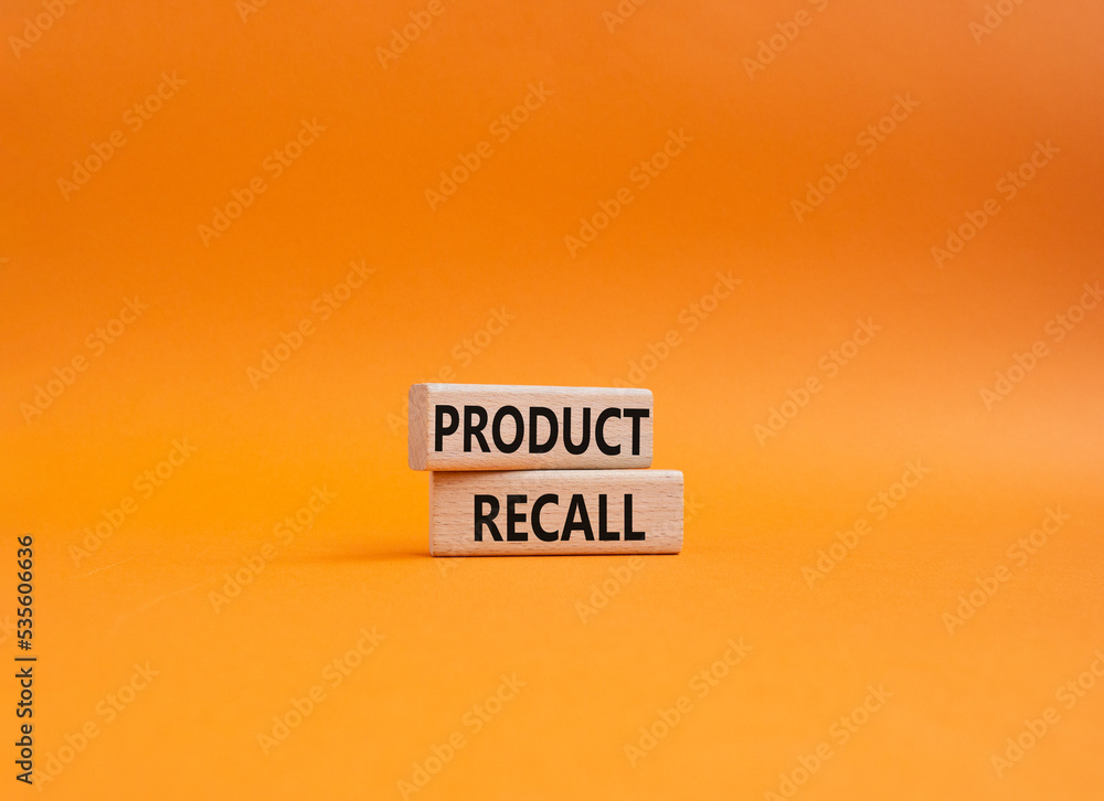 Product recall symbol. Concept words Product recall on wooden blocks. Beautiful orange ...