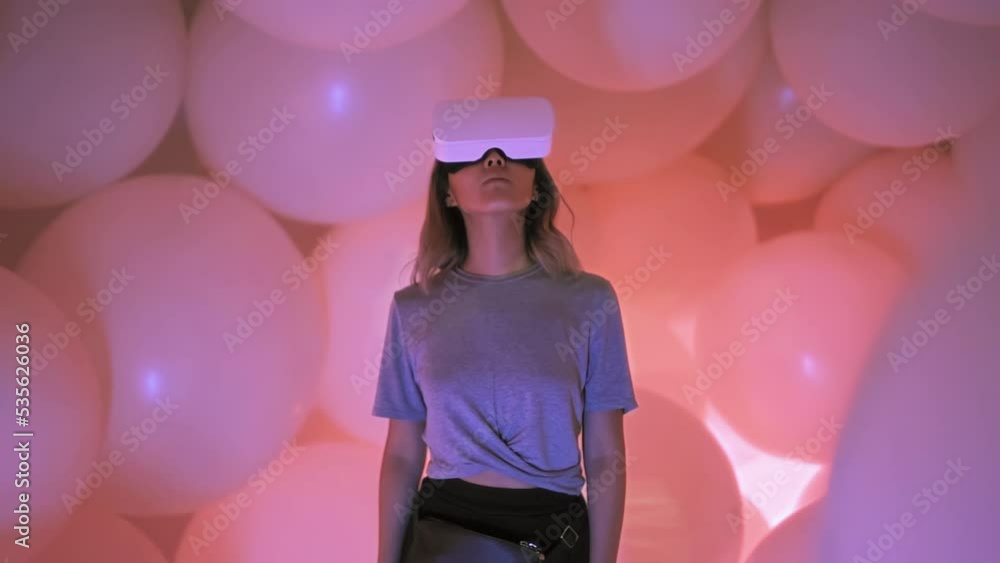 Gamer girl inside 3D videogame. Asian woman wearing VR glasses in ...