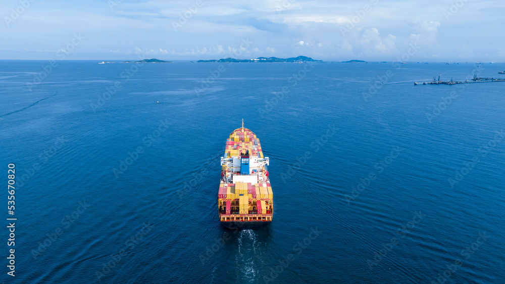Stern of large cargo ship import export container box on the ocean sea ...