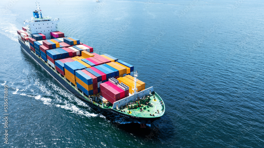 Aerial front of cargo ship carrying container and running Stock Photo ...