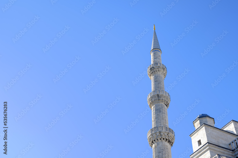 islamic mosque tower with background of blue sky Stock Photo | Adobe Stock
