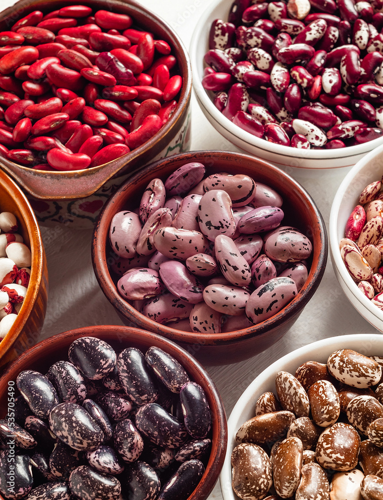 Ceramic bowls with different organic beans. Scarlet runner, kidney ...