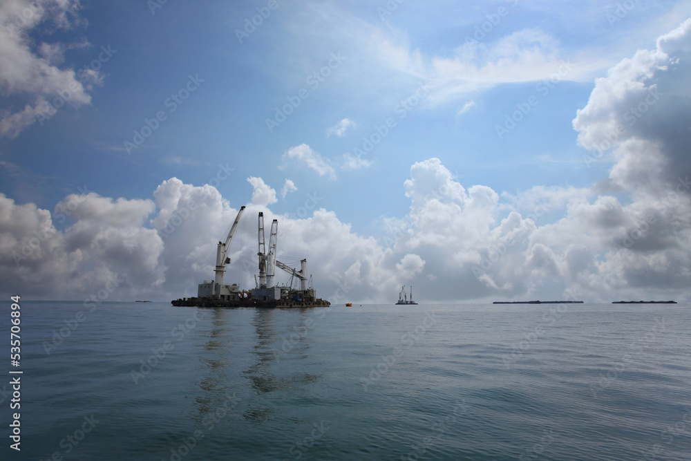 Marine cranes are used for loading and unloading cargo onto ships ...