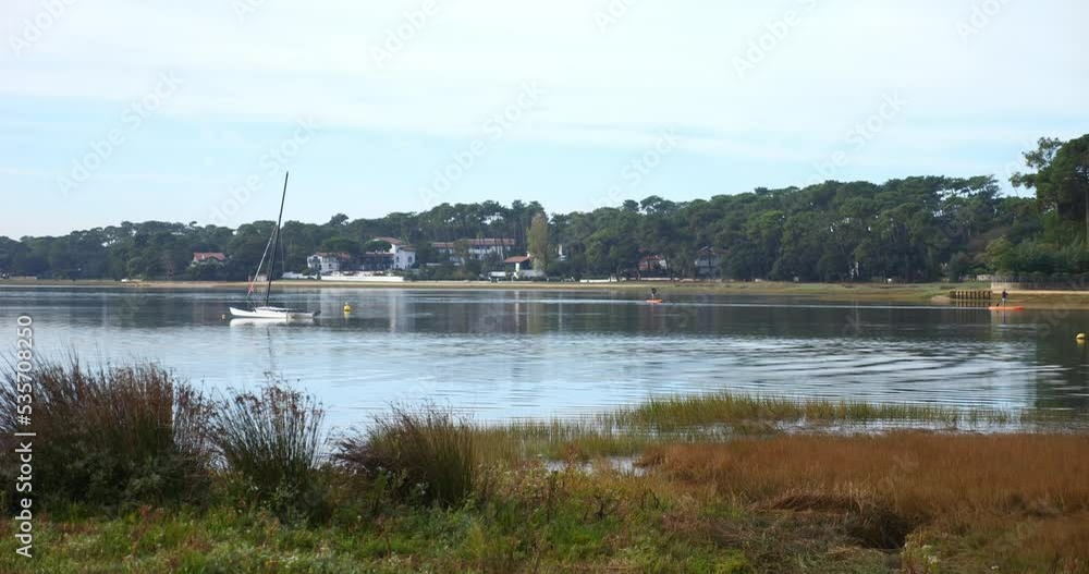 Landscape in 4k of the marine lake of Capbreton at dawn with paddle ...