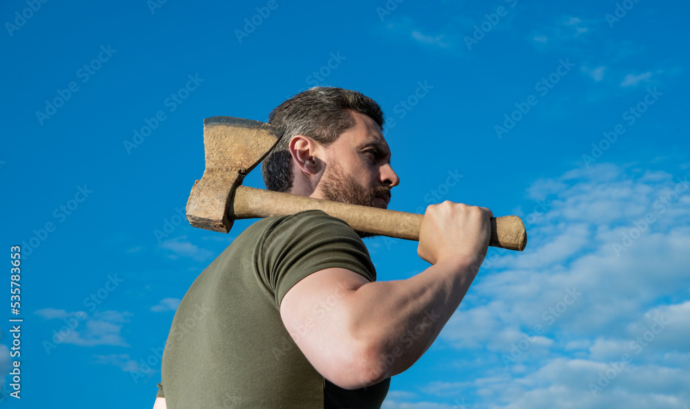 back view of guy with axe. woodman man hold ax. brutal man on sky ...