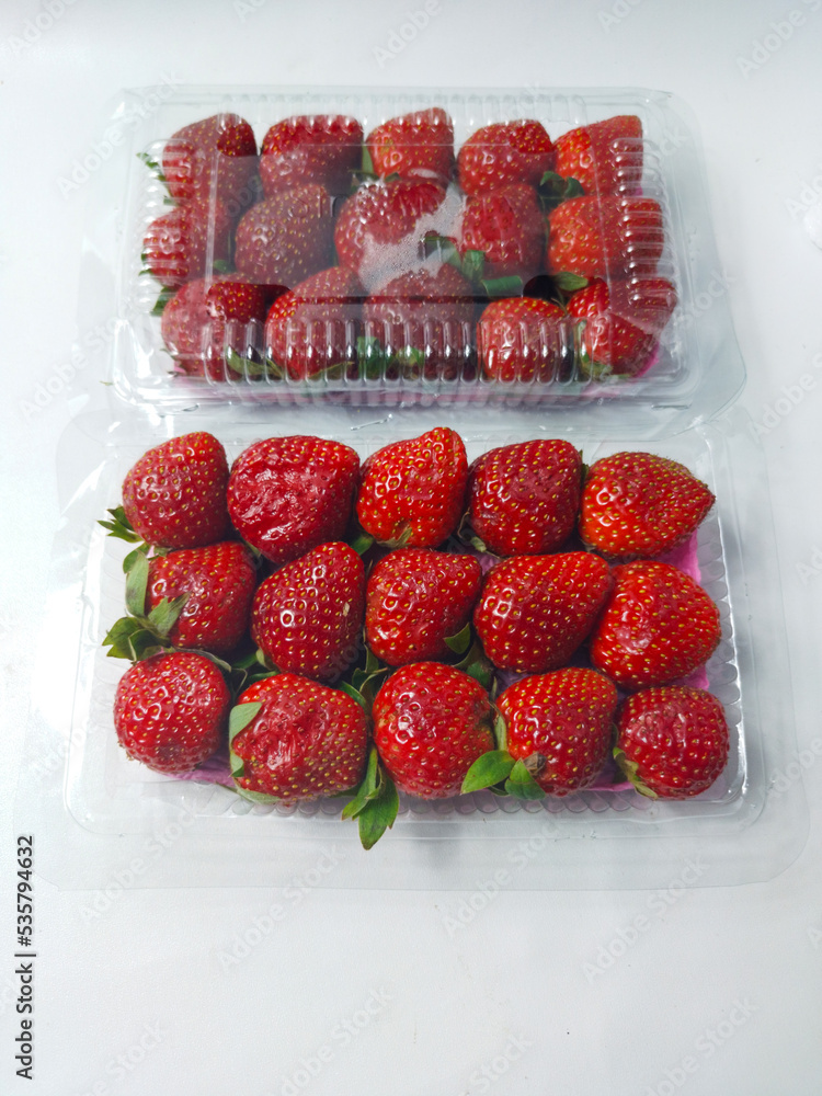 Strawberry package isolated on a white background with a clipping path ...