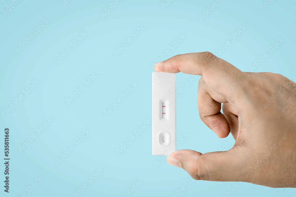 Own hand showing Covid-19 positive test result with SARS CoV-2 Rapid ...