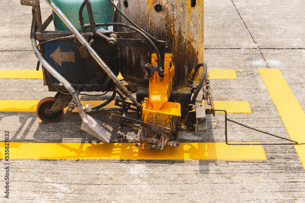 Close up of thermoplastic spray marking machine making lines for ...