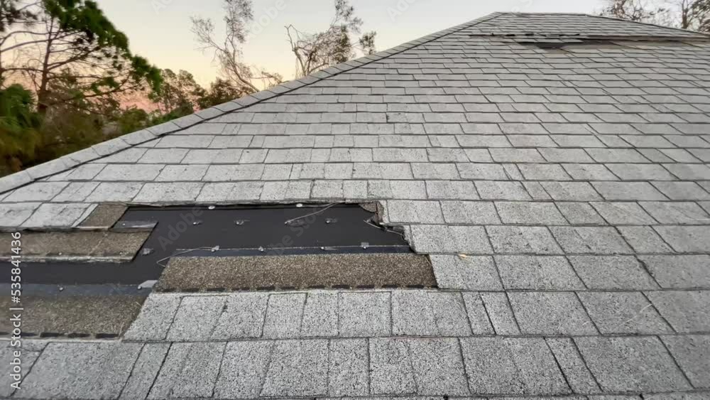 Home roof wind hurricane storm damage torn off missing shingles repair ...