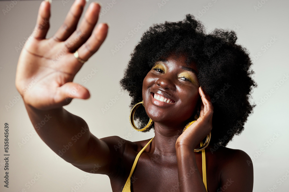 Black beauty, hand and woman with yellow makeup, face cosmetics and ...