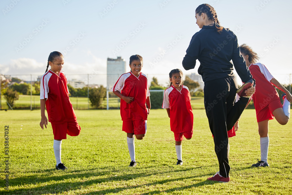 Team, soccer and girls stretching in football stadium with coach in ...
