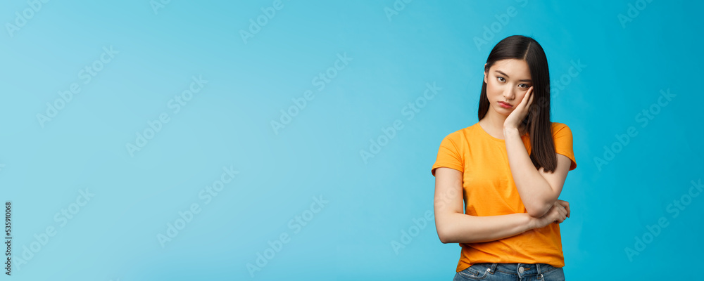 Sad bored asian female student attend boring uninteresting lecture lean ...