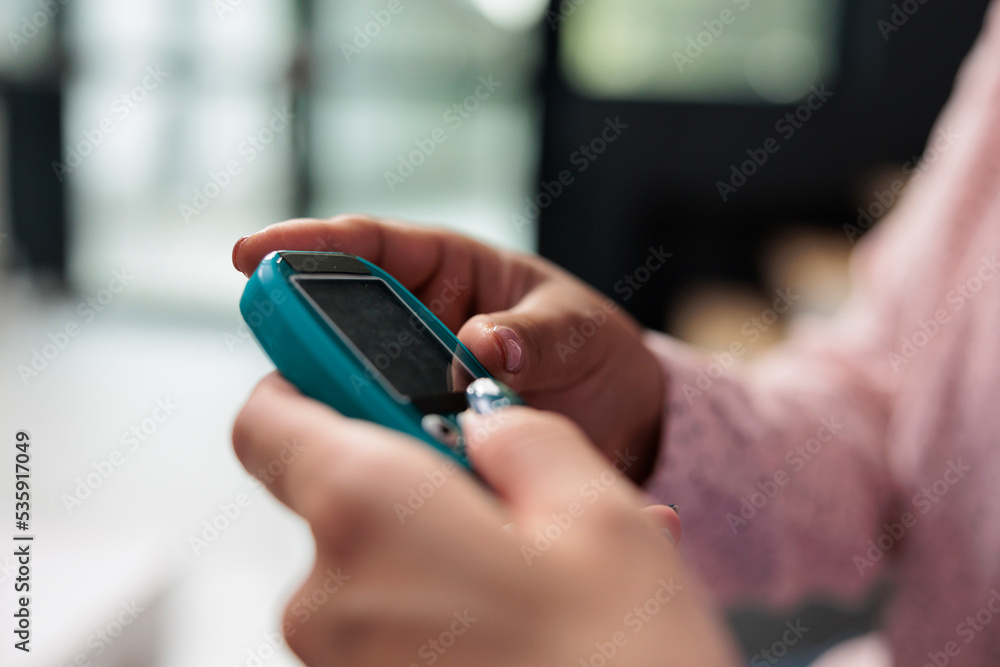 Nurse doing insulin level measurement with instrument to help woman ...