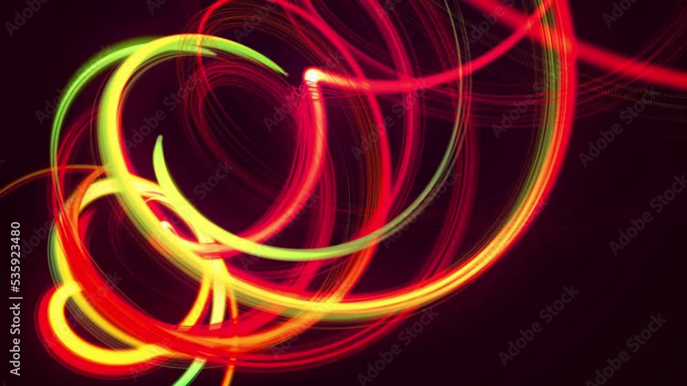 Light streaks or multicolor light trails. Flow of lines twisted and ...