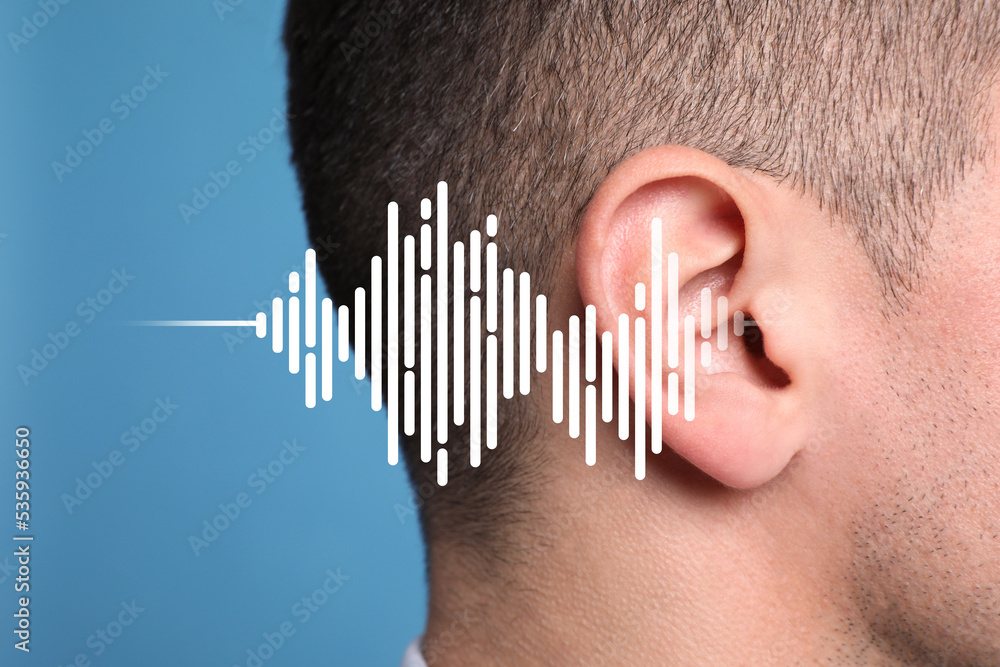 Hearing loss concept. Man and sound waves illustration on light blue ...