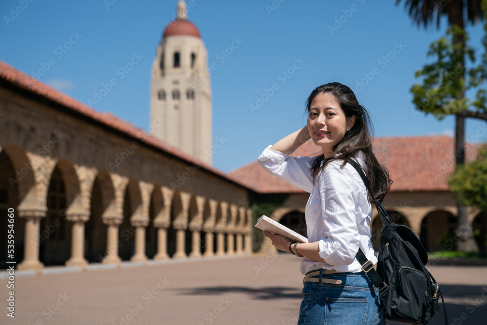 Foto de attractive asian Chinese female exchange student pushing hair ...