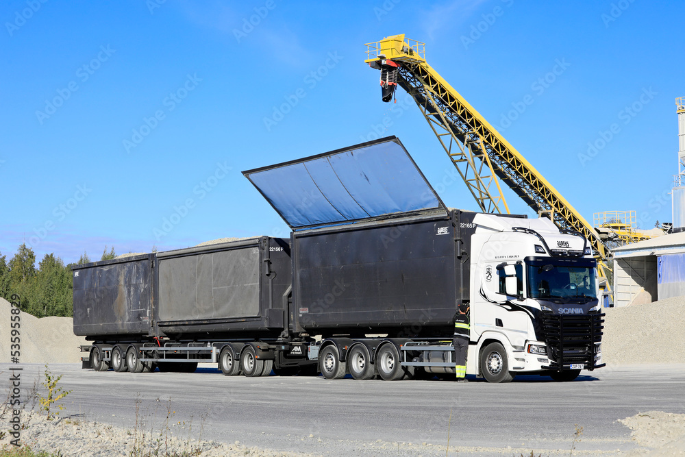 Closing the trailer roof for transport after loading foam glass ...