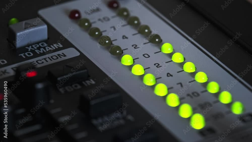 LED indicator of sound level signal on the mixing console. Close-up ...