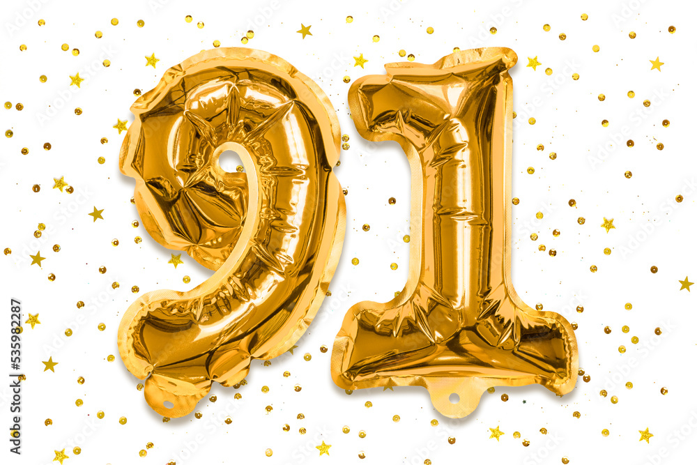 The number of the balloon made of golden foil, the number ninety-one on a white background with ...