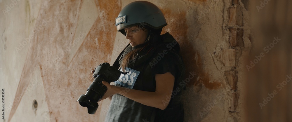 CU Portrait of Caucasian female war journalist wearing protective ...
