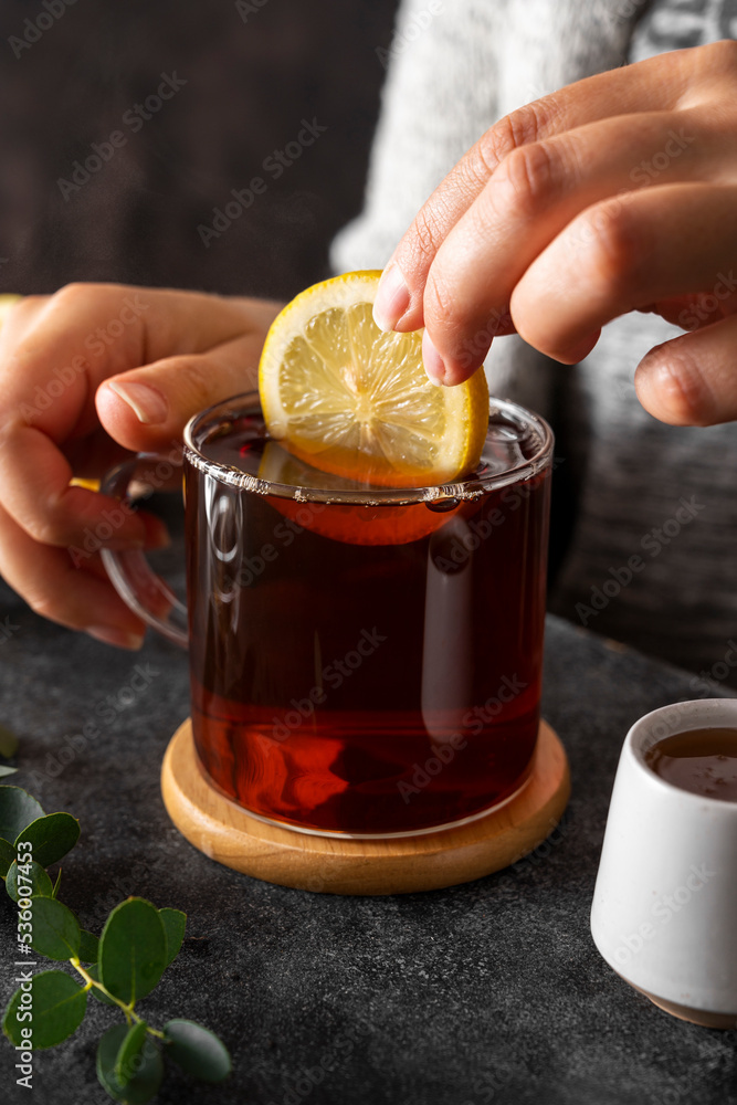 Black tea in glass cup, morning hot drink with lemon and honey. Stock ...
