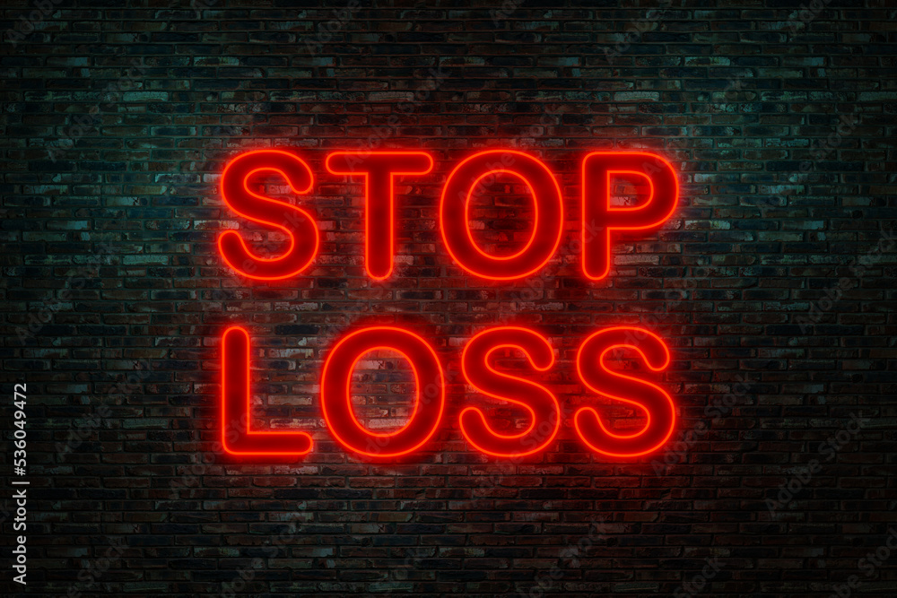 Stopp Loss - red neon sign. Red brick wall and the text "Stop Loss" in ...