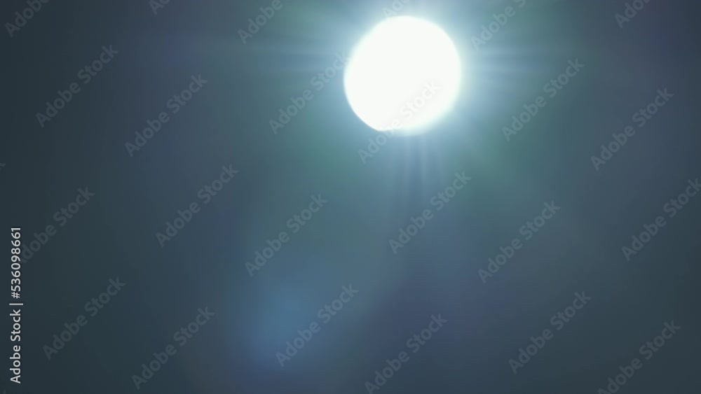 Real lens flare. Sun motion effect. Moving light circle and beams on ...