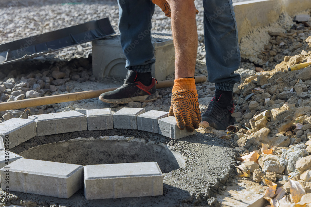 Worker constructing pit for septic tank sewer manhole reconstruction of ...