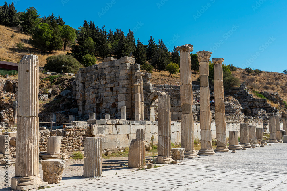 Columns and ruins of the Basilica Stoa in Ephesus. Perspective of the ...