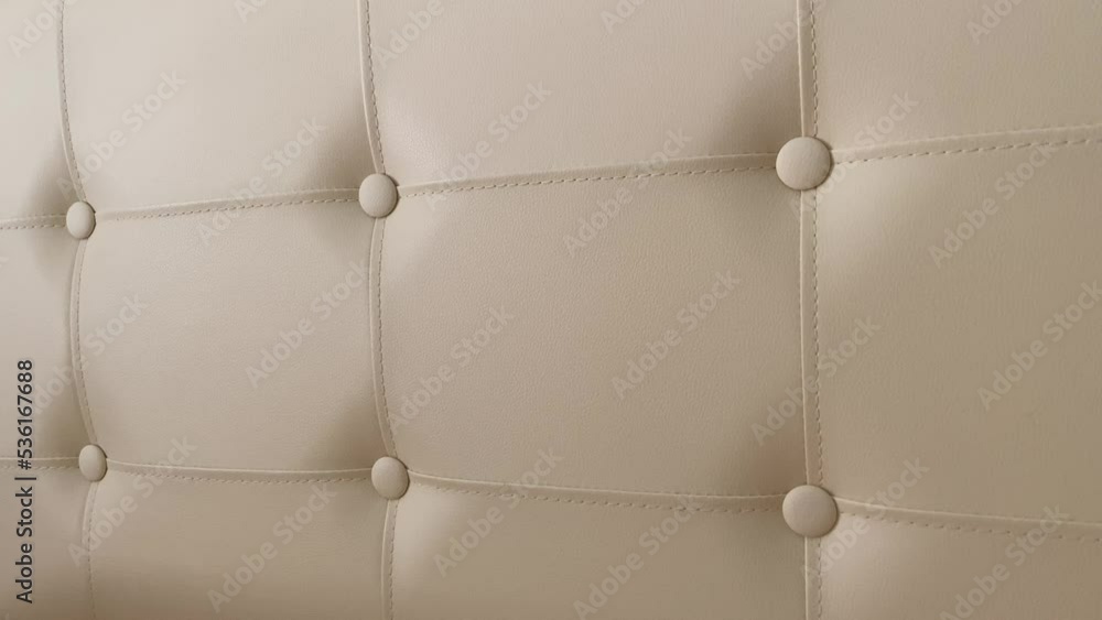 leather pattern upholstery wall with inset button tufting and folds ...