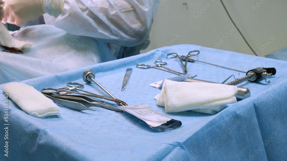 On the table in the operating room are surgical instruments after the ...