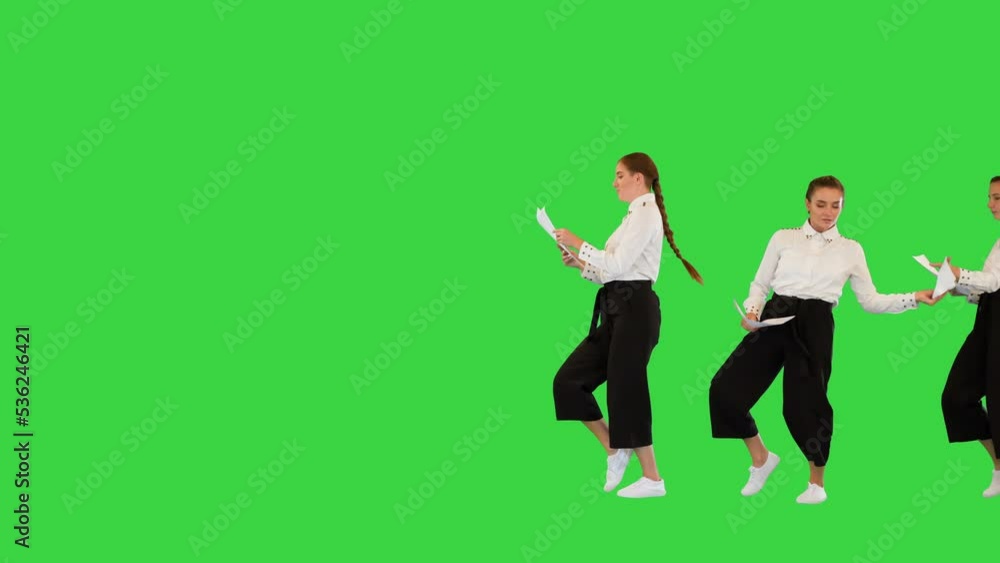 Funny ladies in office suits pass through, giving each other sheets of ...